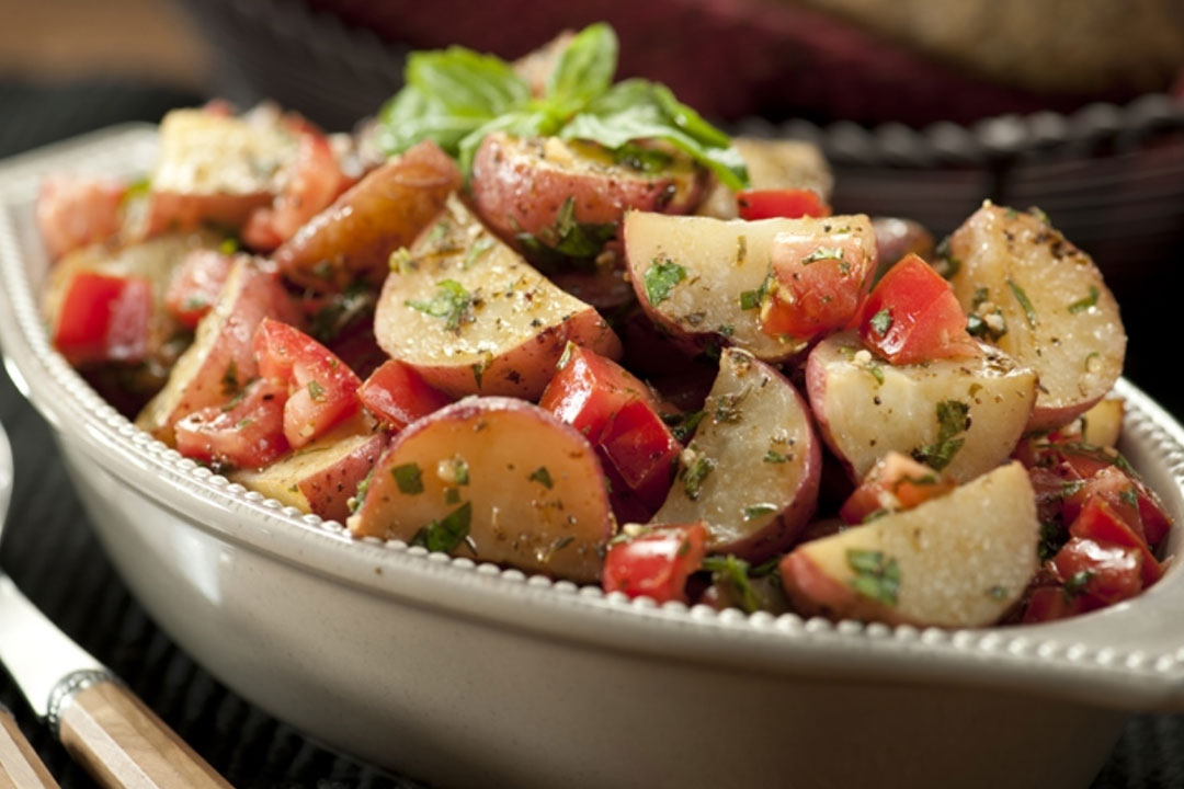 Roasted Potatoes with Tomatoes, Basil and Garlic - Mazola® Oils